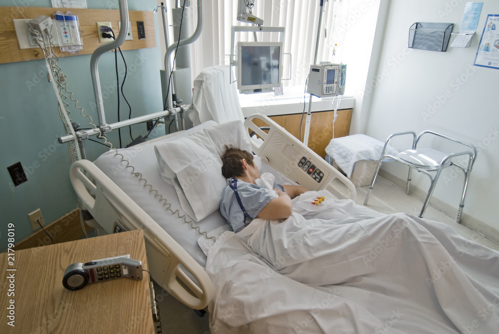 Patient recuperating from surgery in hospital room Stock Photo | Adobe ...