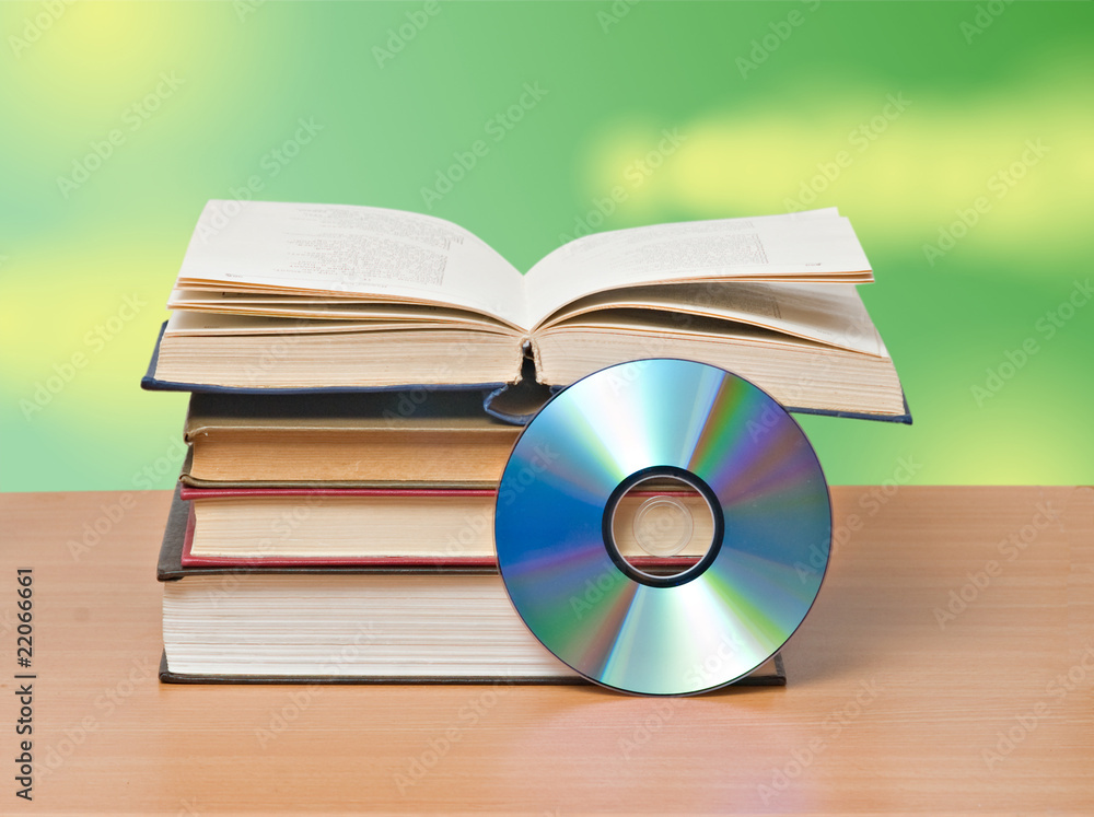 open book and DVD disk as symbols of old and new methods of inf Stock ...