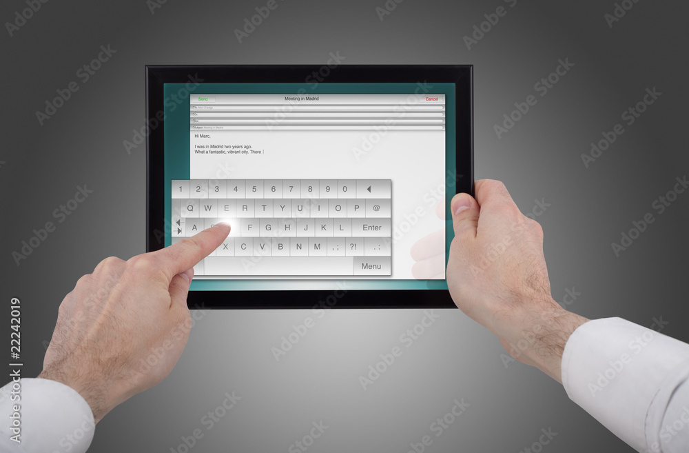 male hand holding a touchpad pc and writing an e-mail Stock Photo ...