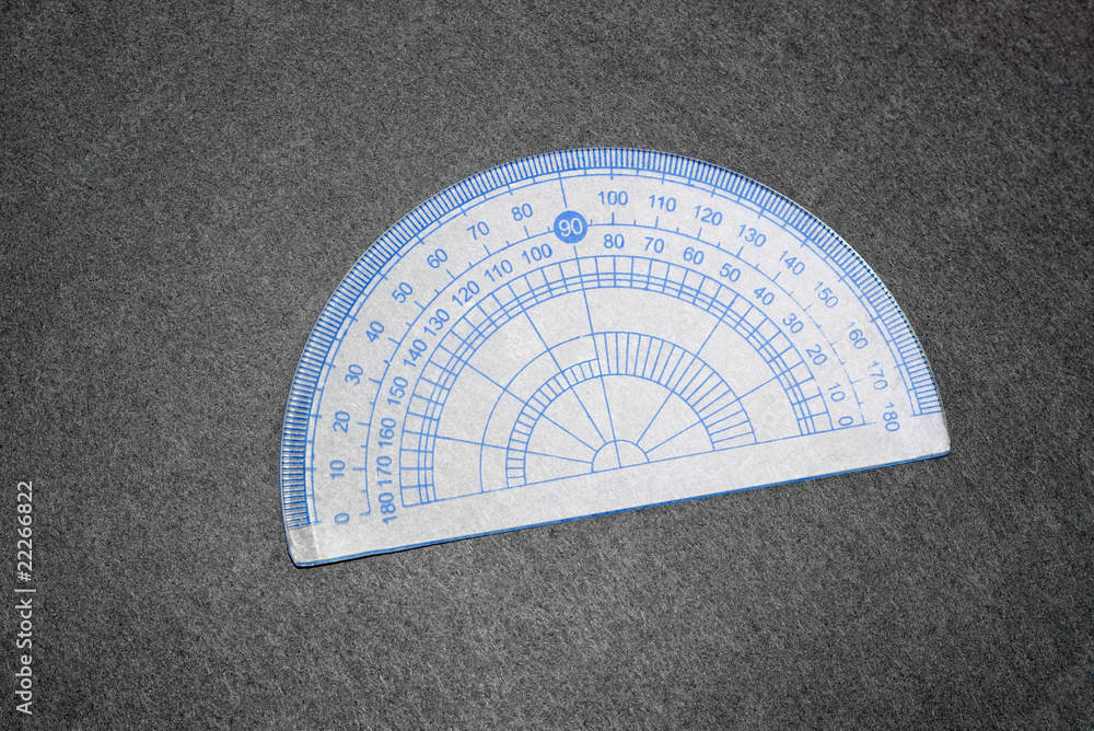 Closeup of transparent blue protractor on black paper texture Stock ...