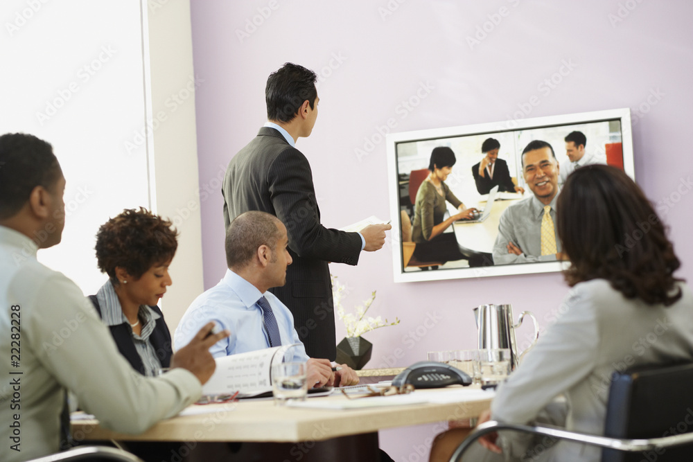 Multi-ethnic businesspeople having video conference Stock Photo | Adobe ...
