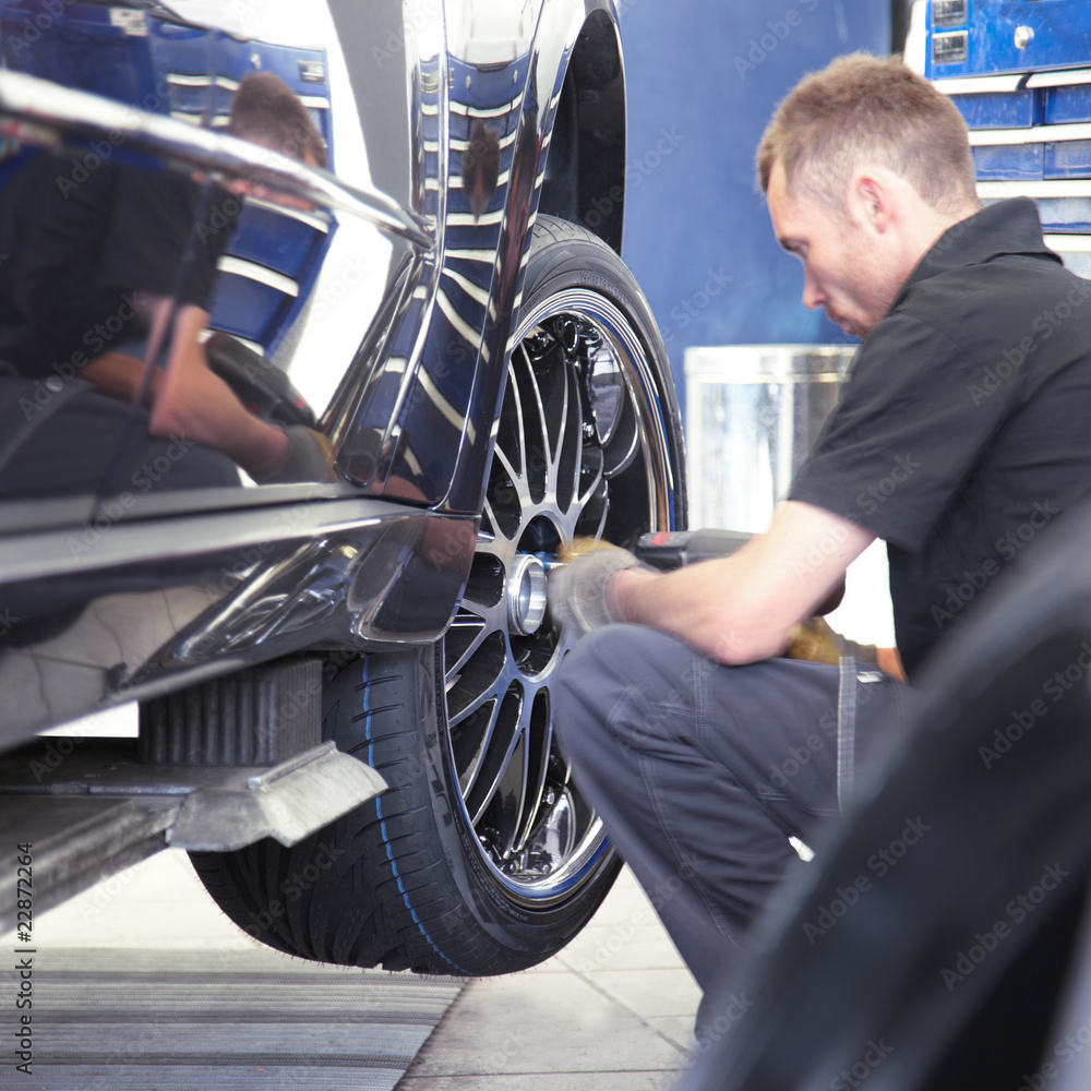 Tyre changing with new alu rim on a suv Stock Photo | Adobe Stock