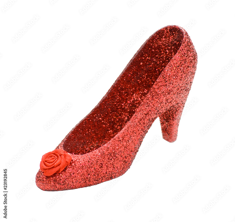 There’s no place like home – A ruby red stiletto shoe, isolated Stock ...