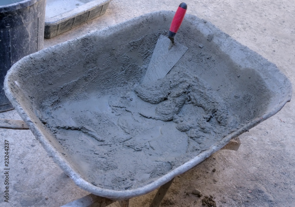 wheelbarrow and cement Stock Photo | Adobe Stock