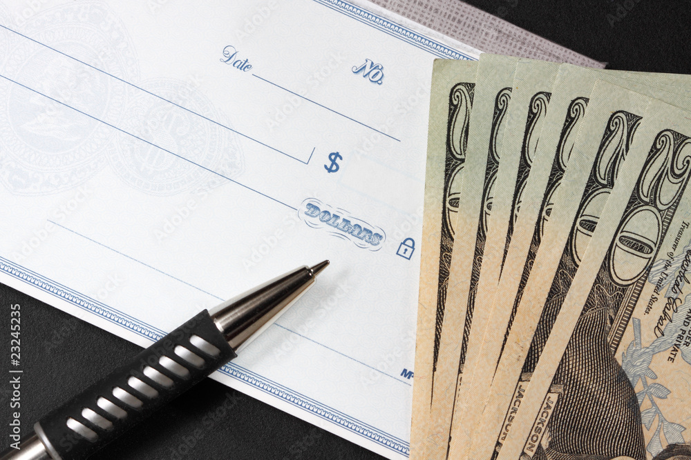 blank check with twenty dollar bills at its side Stock Photo | Adobe Stock