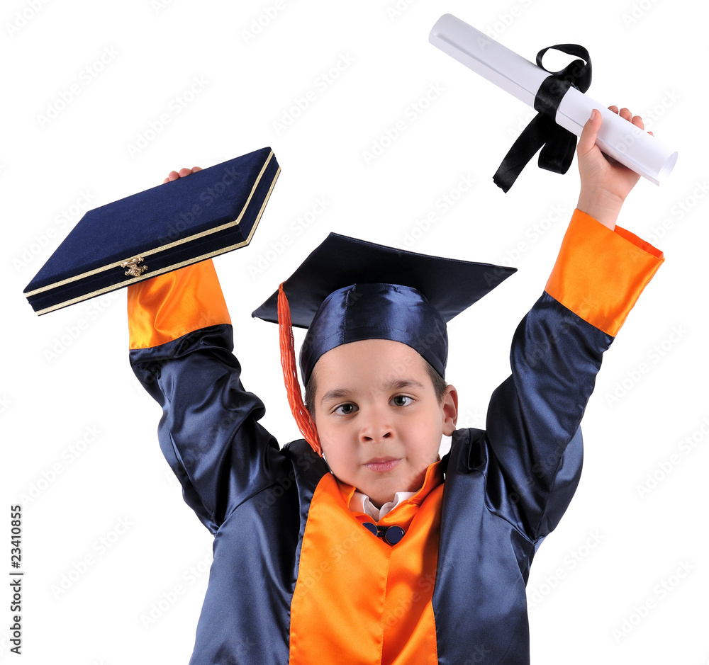 Elementary boy wearing graduation cap and gown shows his diploma Stock ...