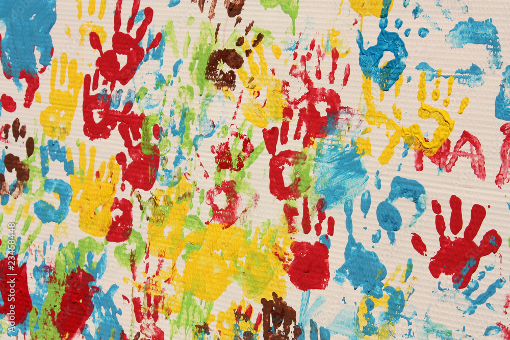 Handprints in different colors in a mural. Stock Photo | Adobe Stock