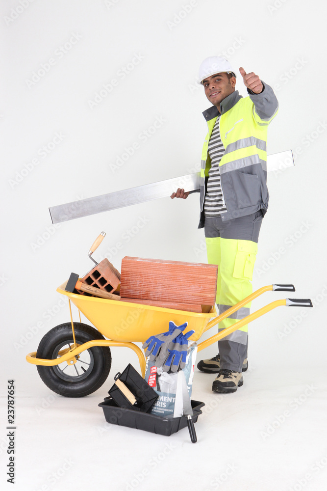 Maçon avec matériel de chantier Stock Photo | Adobe Stock