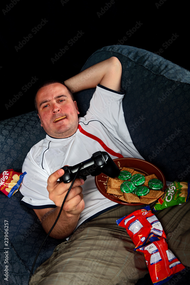 England football supporter slob on sofa playing games Stock Photo ...