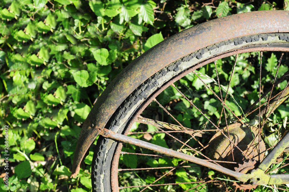 Rusty wheel of a broken-down bike Stock Photo | Adobe Stock