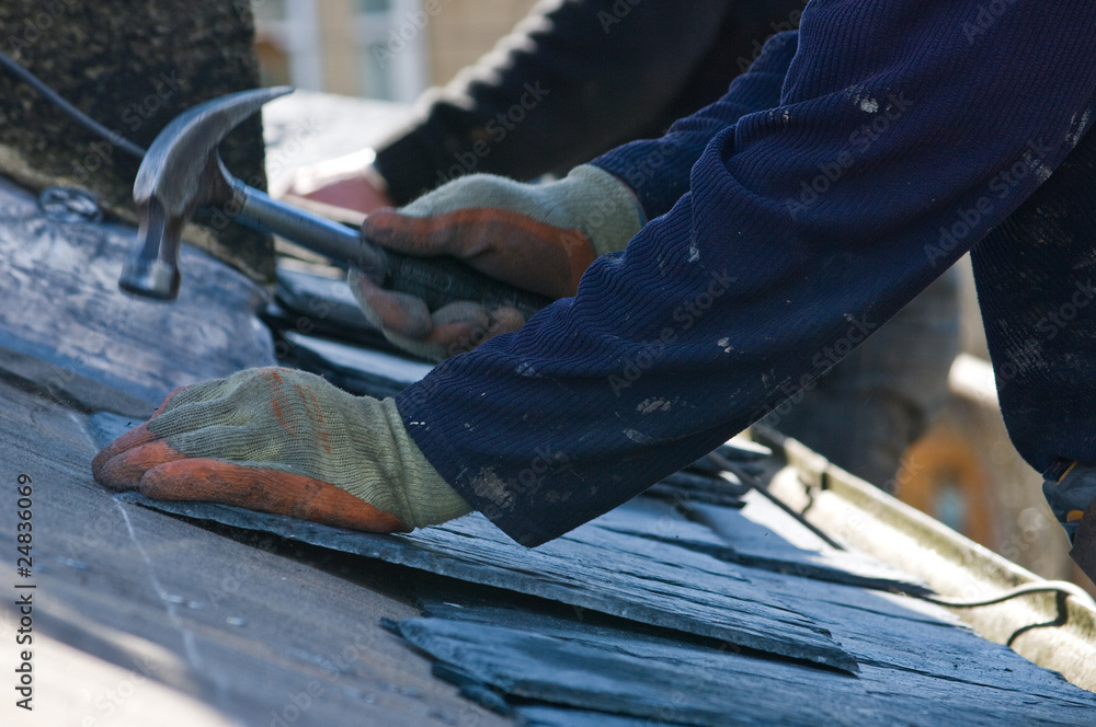 Roofer hammering close up Stock Photo | Adobe Stock