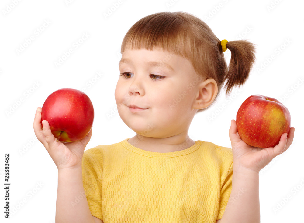 Cute child choose between two apples Stock Photo | Adobe Stock