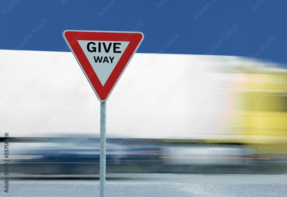 Give way yield traffic sign with text and truck Stock Photo | Adobe Stock
