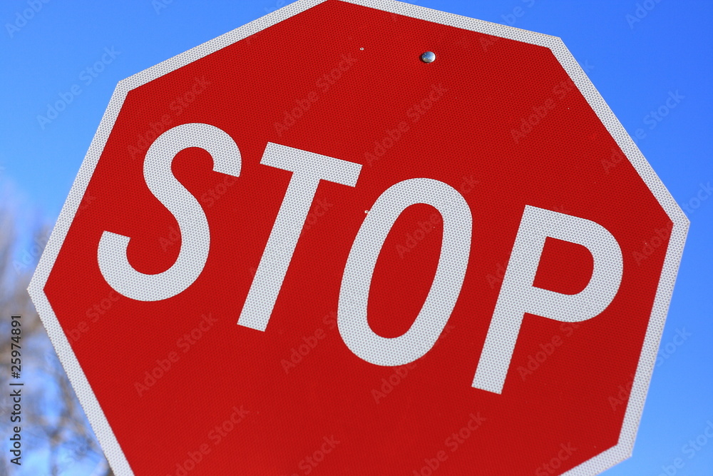 Red Stop Sign on Blue Sky Stock Photo | Adobe Stock