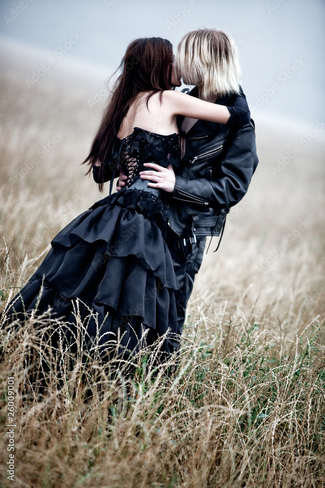 Young goth couple kissing outdoors Stock Photo | Adobe Stock