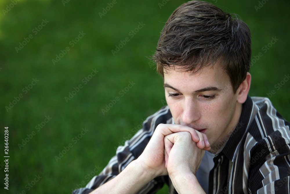 thinking teen boy Stock Photo | Adobe Stock