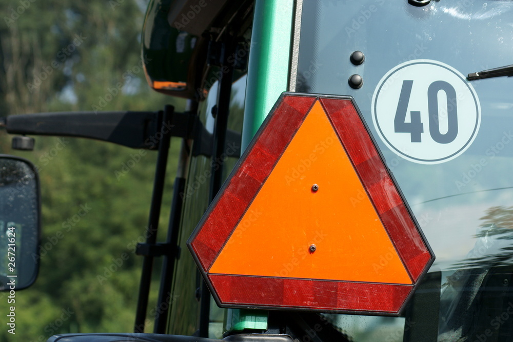 Warning triangle on tractor Stock Photo | Adobe Stock
