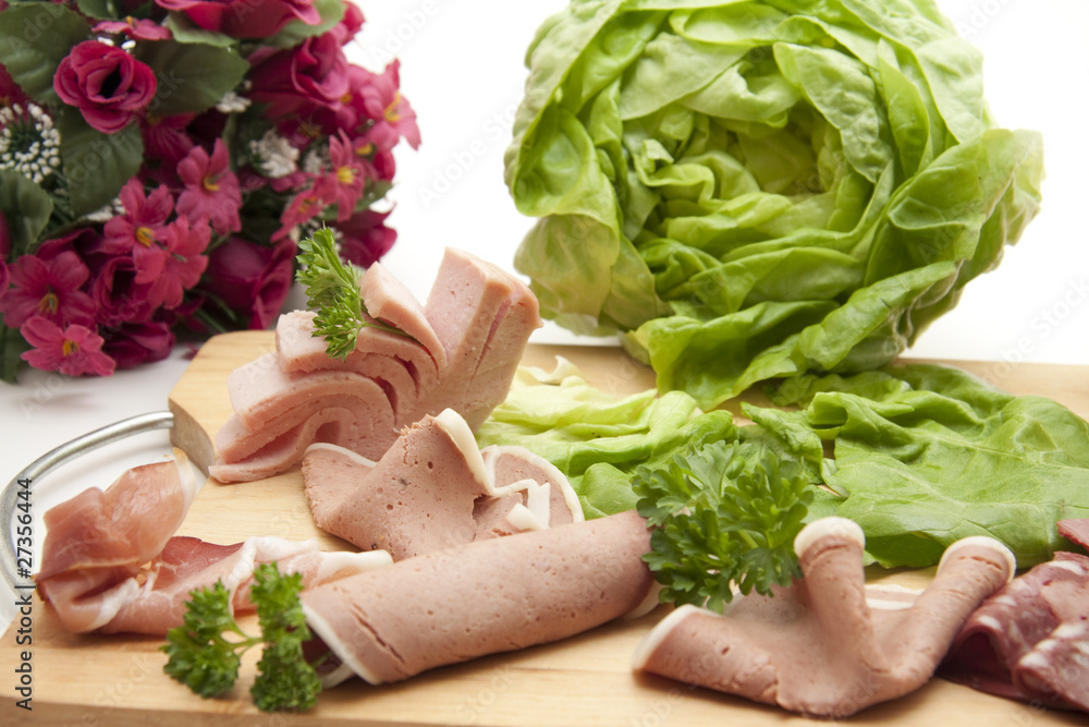 Wurstplatte und Blumenstrauß Stock-Foto | Adobe Stock