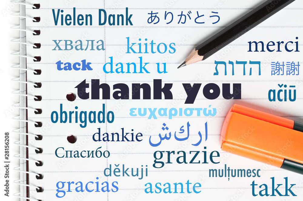 Thank you in many different languages written on an open noteboo Stock ...