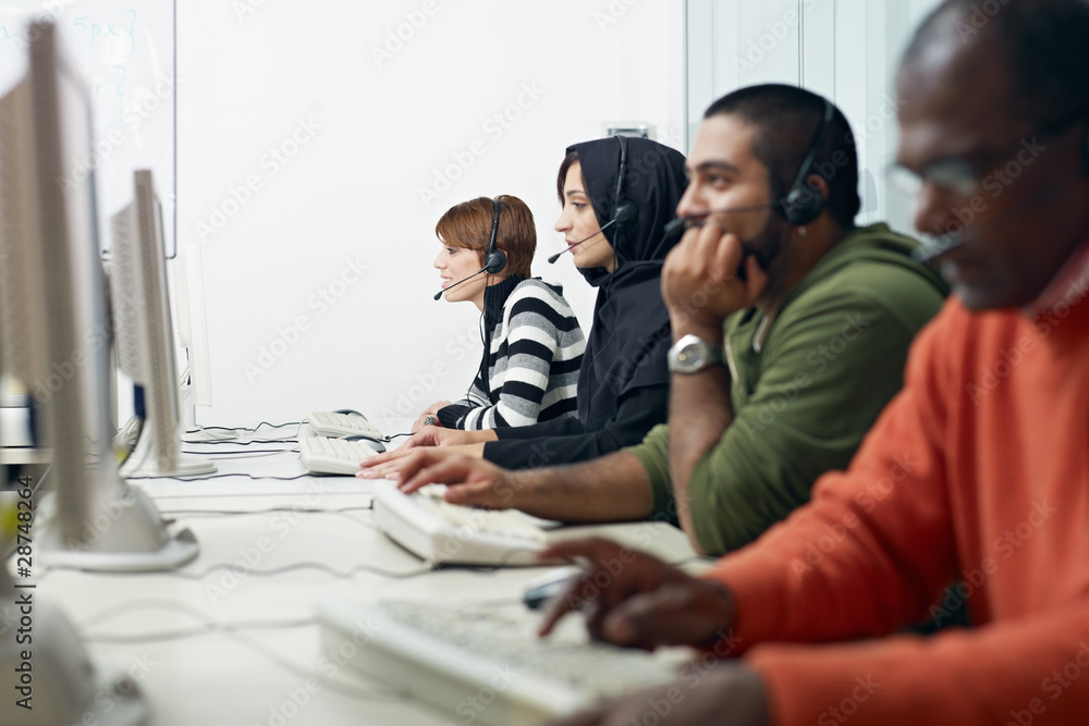 students with headset in computer lab Stock Photo | Adobe Stock