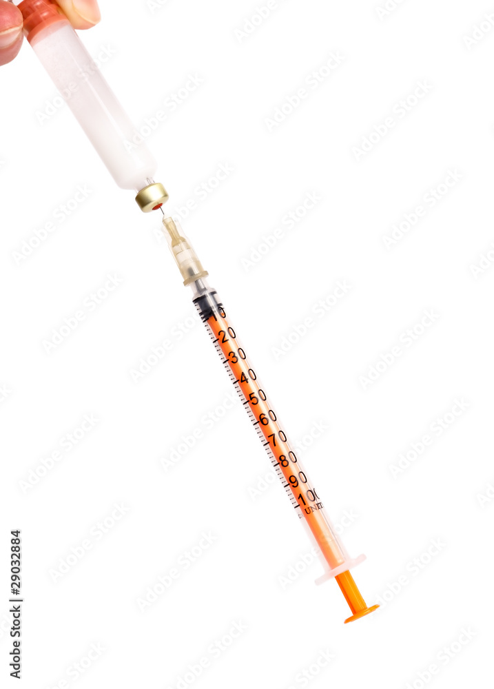 Syringe for insulin with a needle piercing a stopper of a bottle Stock ...
