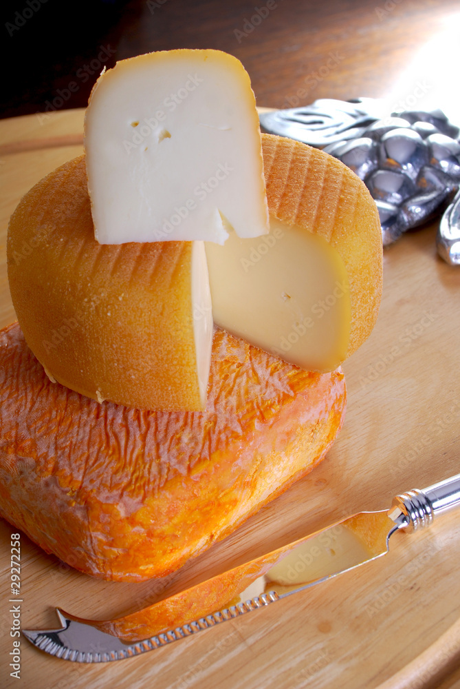 French orange rind cheese on a wooden sheese board Stock Photo | Adobe ...