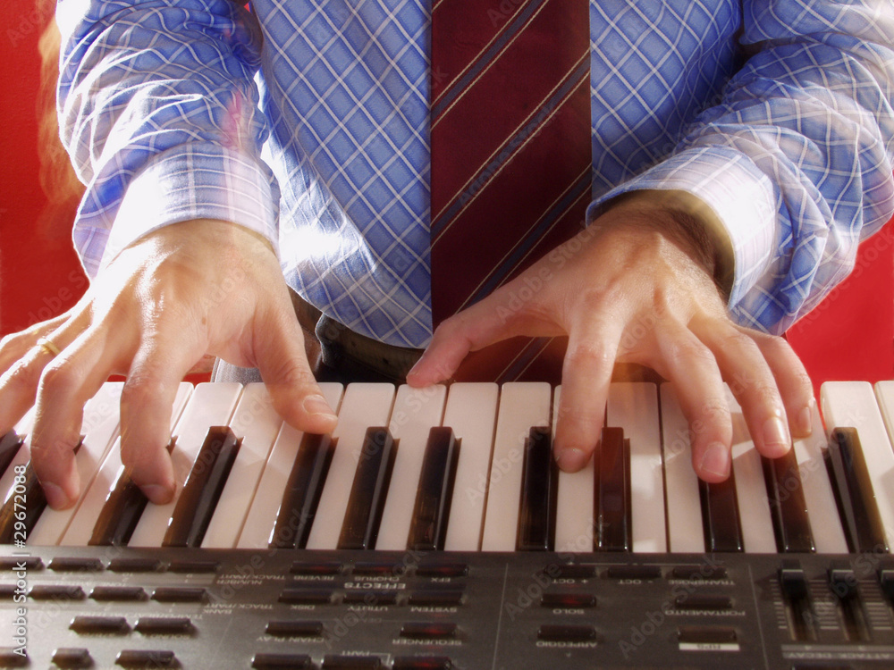 Manos tocando teclado musical. Stock Photo | Adobe Stock