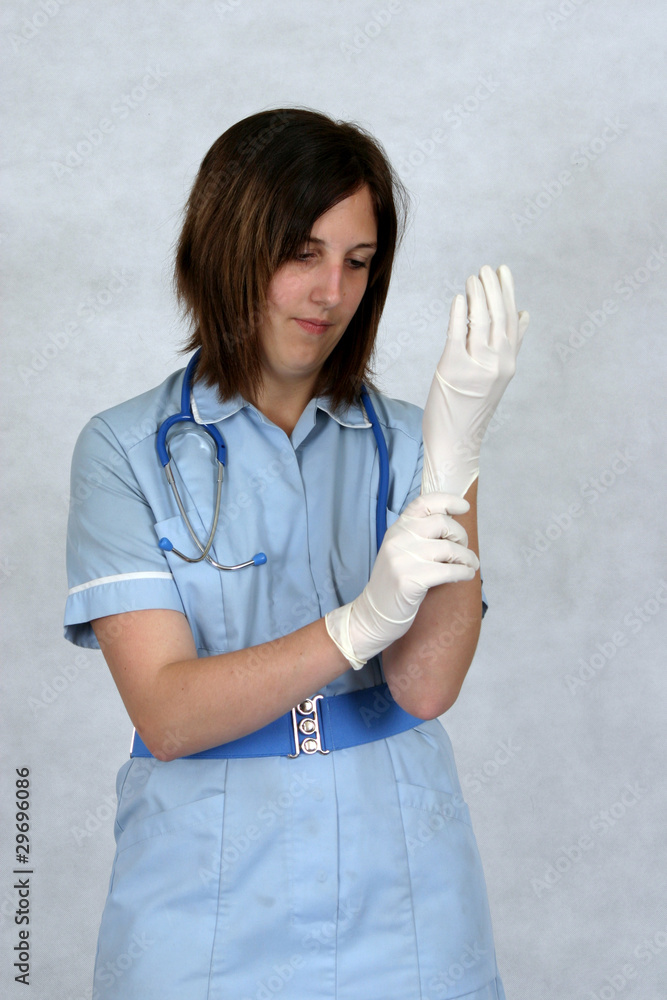 Rubber gloved Nurse getting ready Stock-Foto | Adobe Stock