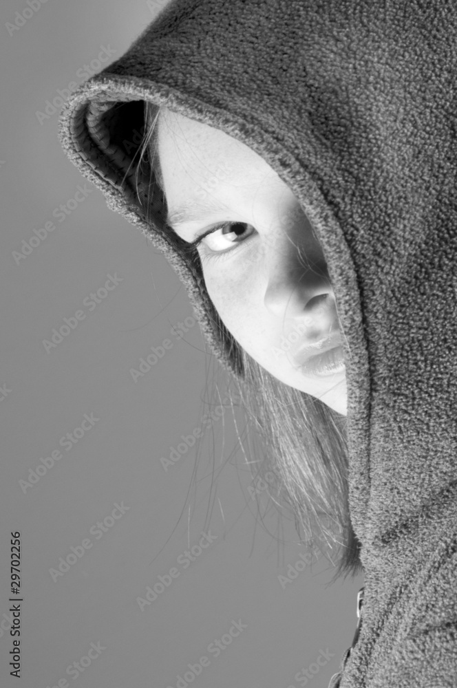 girl hiding behind hood Stock Photo | Adobe Stock
