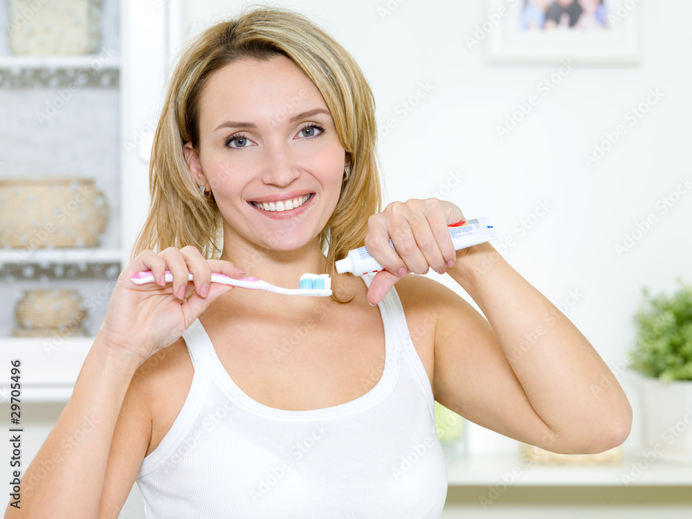 beautiful smiling girl holds toothbrush with a toothpaste foto de Stock ...