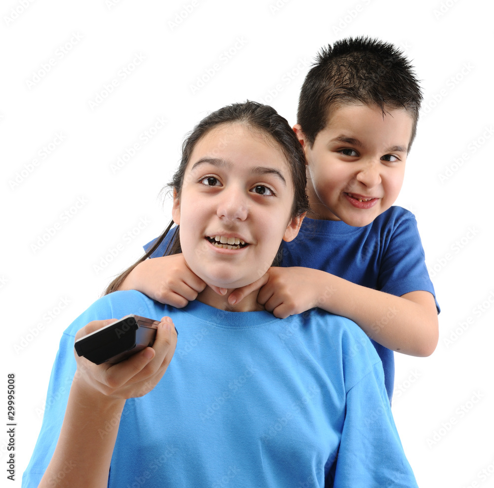 Brother and sister fighting over the TV remote control isolated. Stock ...