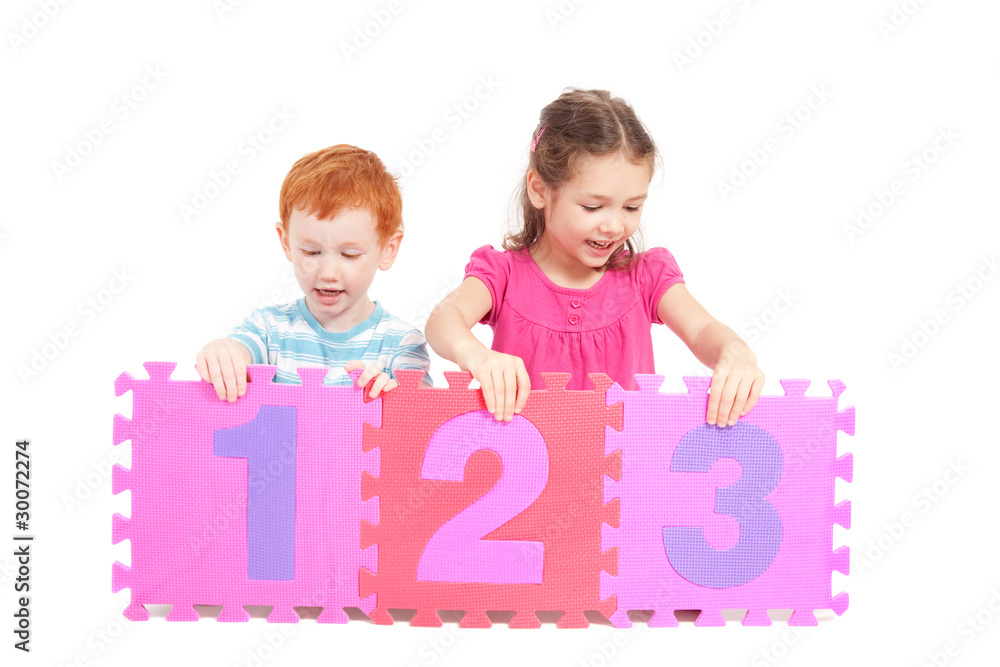 Kids counting 123 with number tiles Stock Photo | Adobe Stock