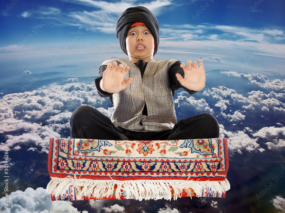 boy on a flying magic carpet Stock Photo | Adobe Stock