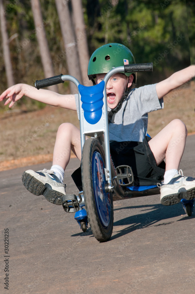 child having fun on trike Stock Photo | Adobe Stock