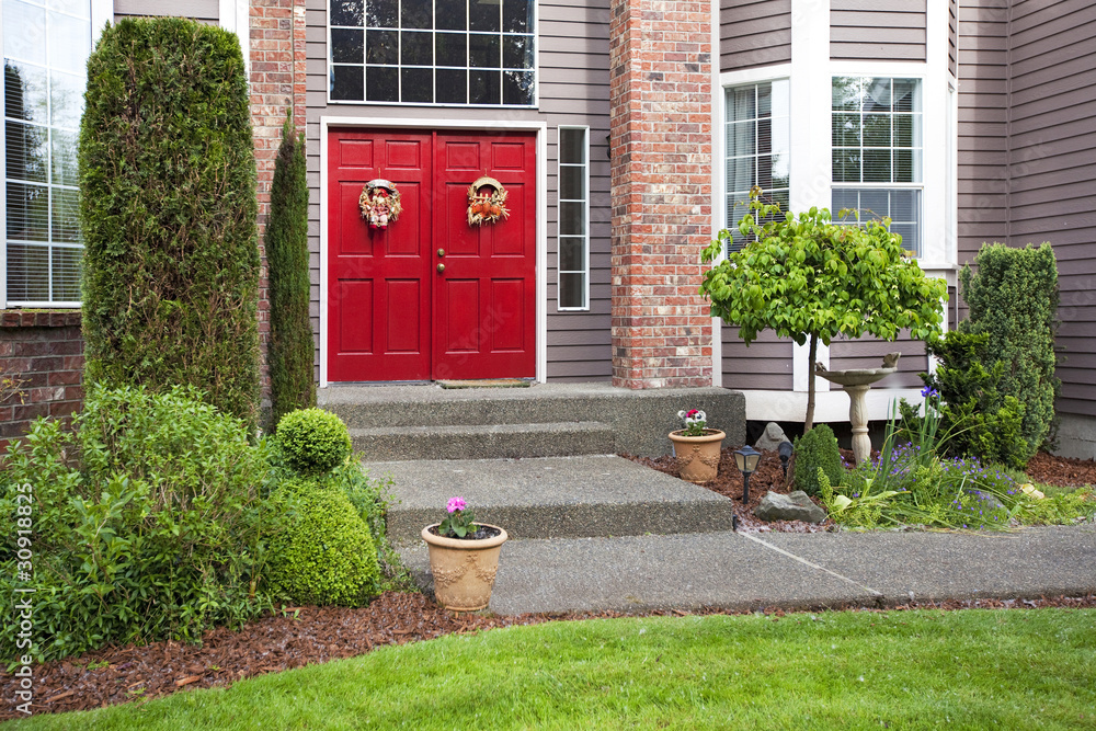 Large red door with grand entrance in a big house Stock Photo | Adobe Stock