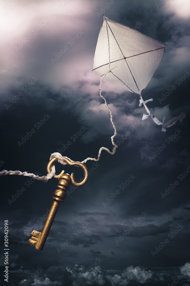 kite with a key flying in a storm Stock Photo | Adobe Stock