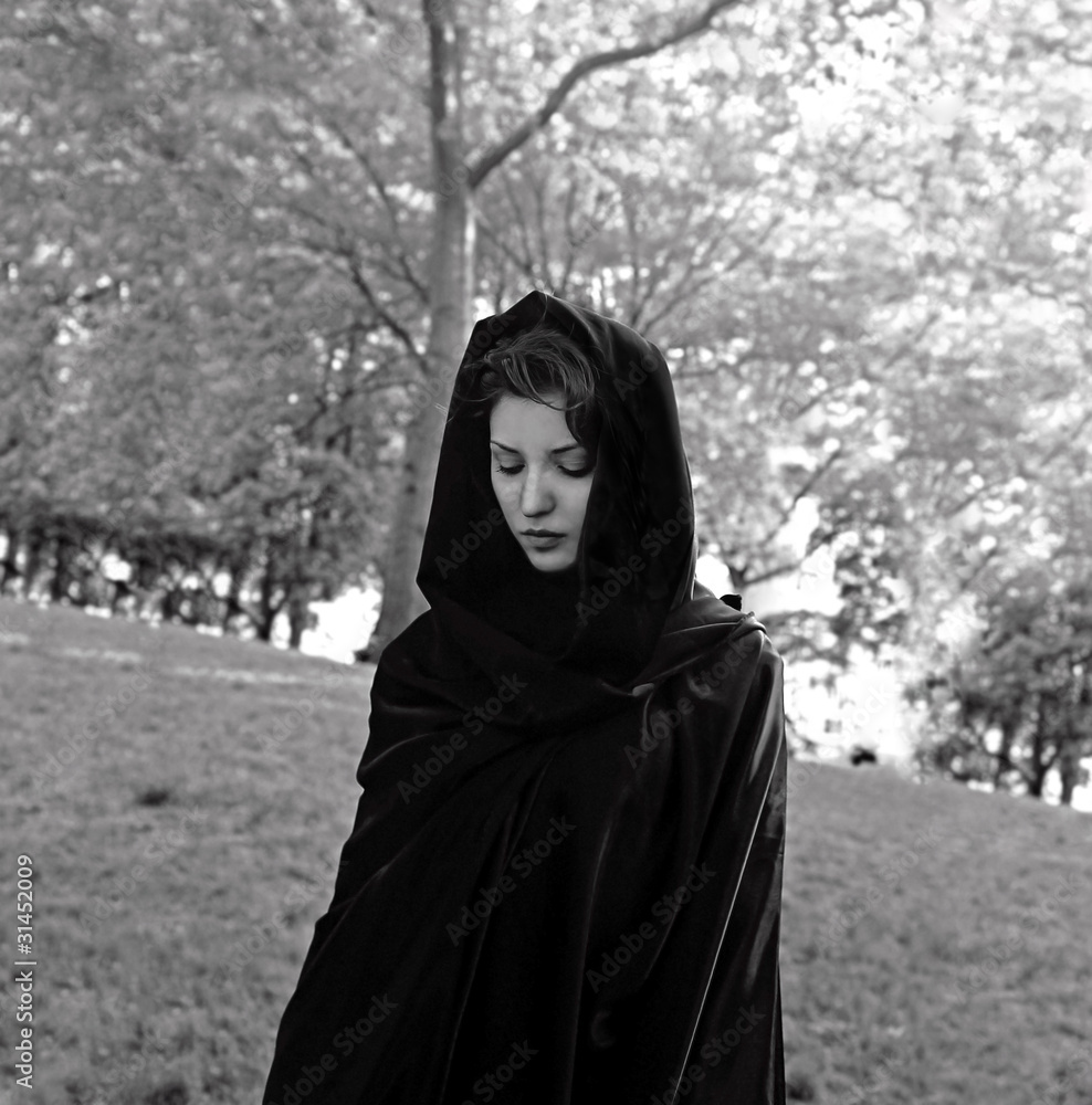 Girl wearing cloak Stock Photo | Adobe Stock