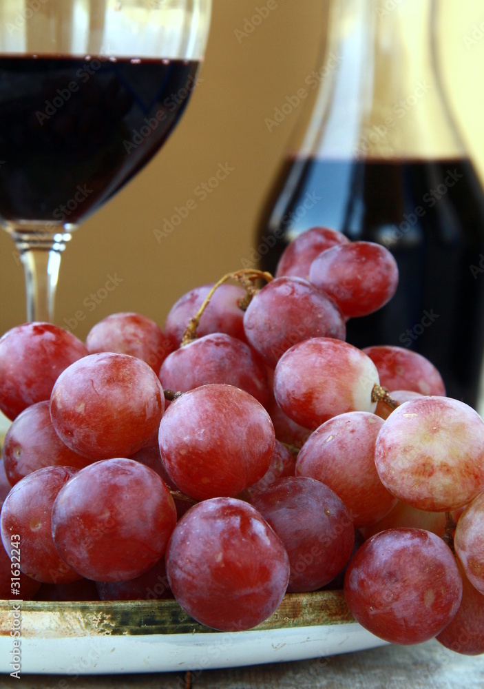 large red ripe grapes and wine on the natural background Stock Photo ...