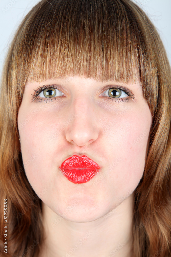 Gespitzte Lippen Stock-Foto | Adobe Stock