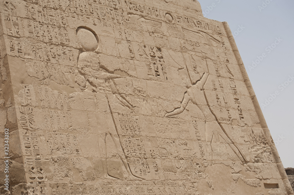 Egyptian hieroglyphics on a temple wall Stock Photo | Adobe Stock