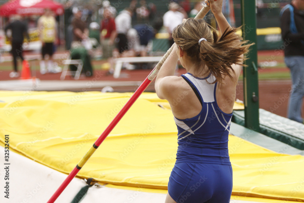 Female athlete competing in the pole vault Stock Photo | Adobe Stock