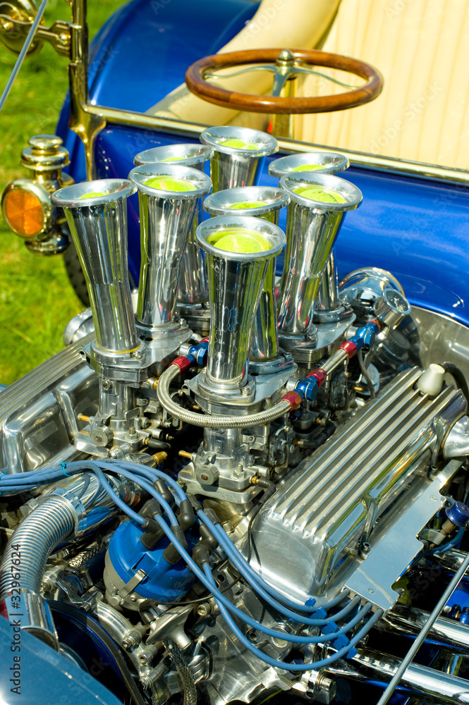 chromed hot-rod vehicle engine with tennis balls in the inlets Stock ...
