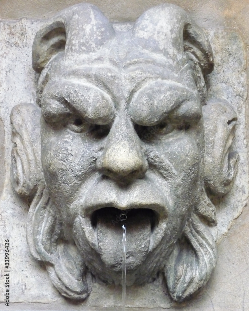 Gargoyle Spitting Water Stock Photo | Adobe Stock