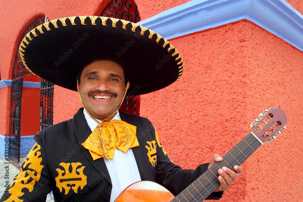 Charro Mariachi playing guitar Mexico houses Stock Photo | Adobe Stock