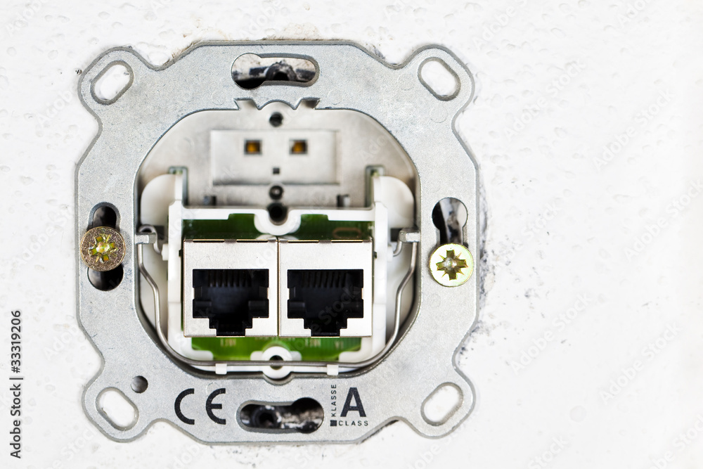 netzwerkdose in der wand Stock-Foto | Adobe Stock