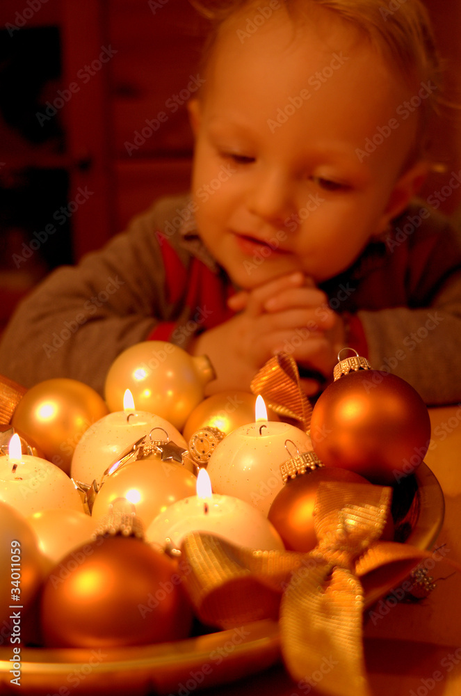 child with candles Stock-Foto | Adobe Stock