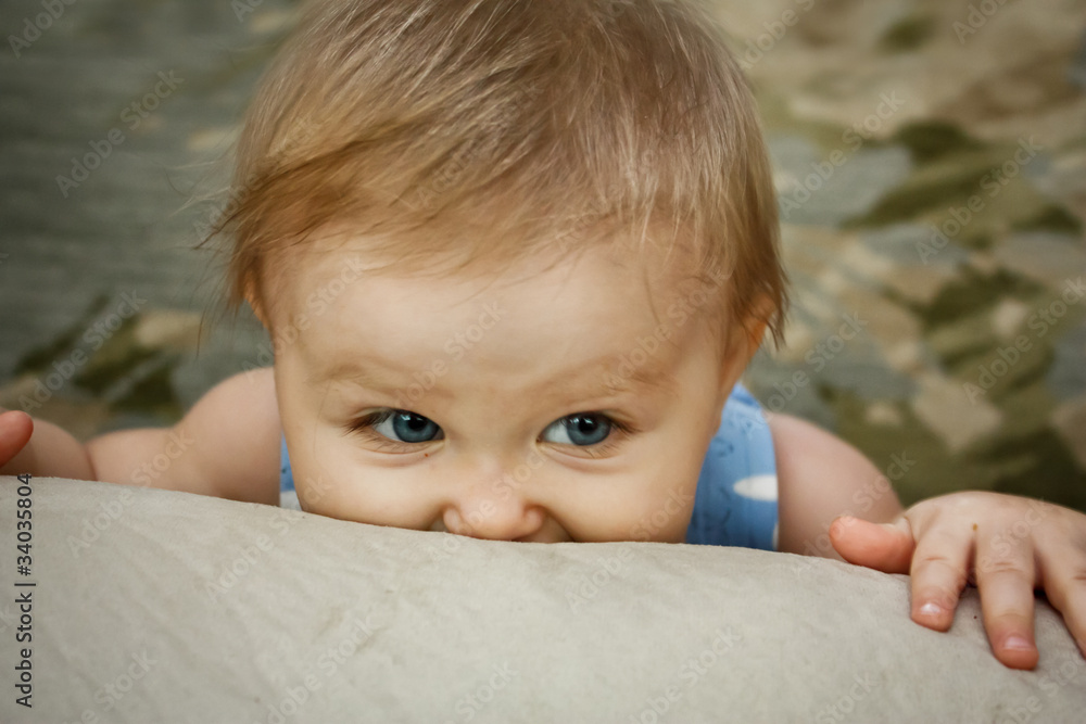 Child Hiding Behind Couch Stock Photo | Adobe Stock