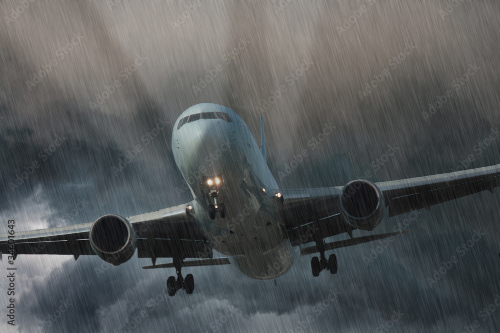 Aircraft landing in bad weather Stock Photo | Adobe Stock