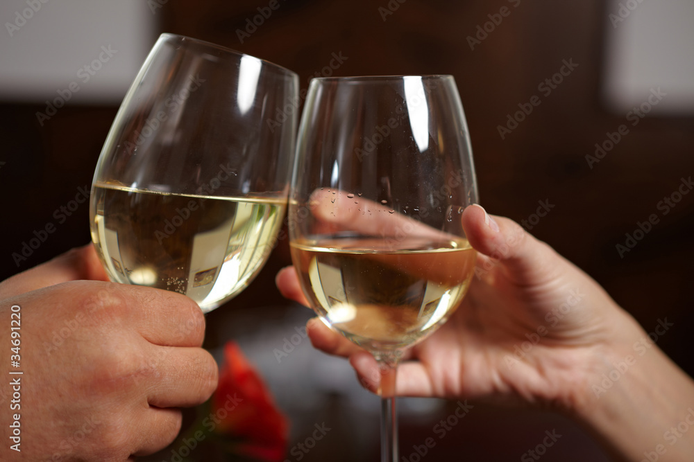 Weingläser prosten sich zu Stock Photo | Adobe Stock