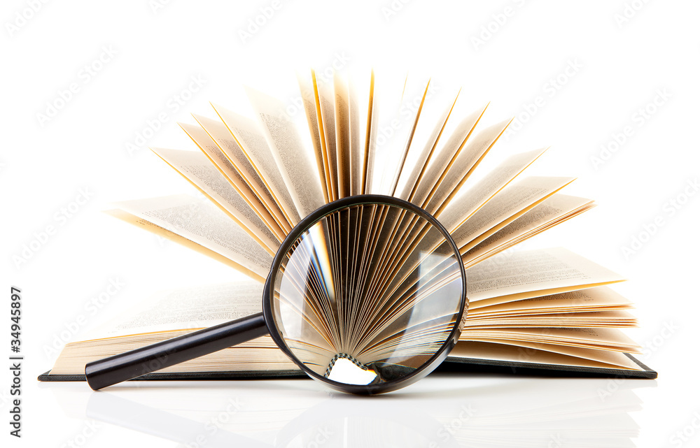 open book with magnifying glass Stock Photo | Adobe Stock
